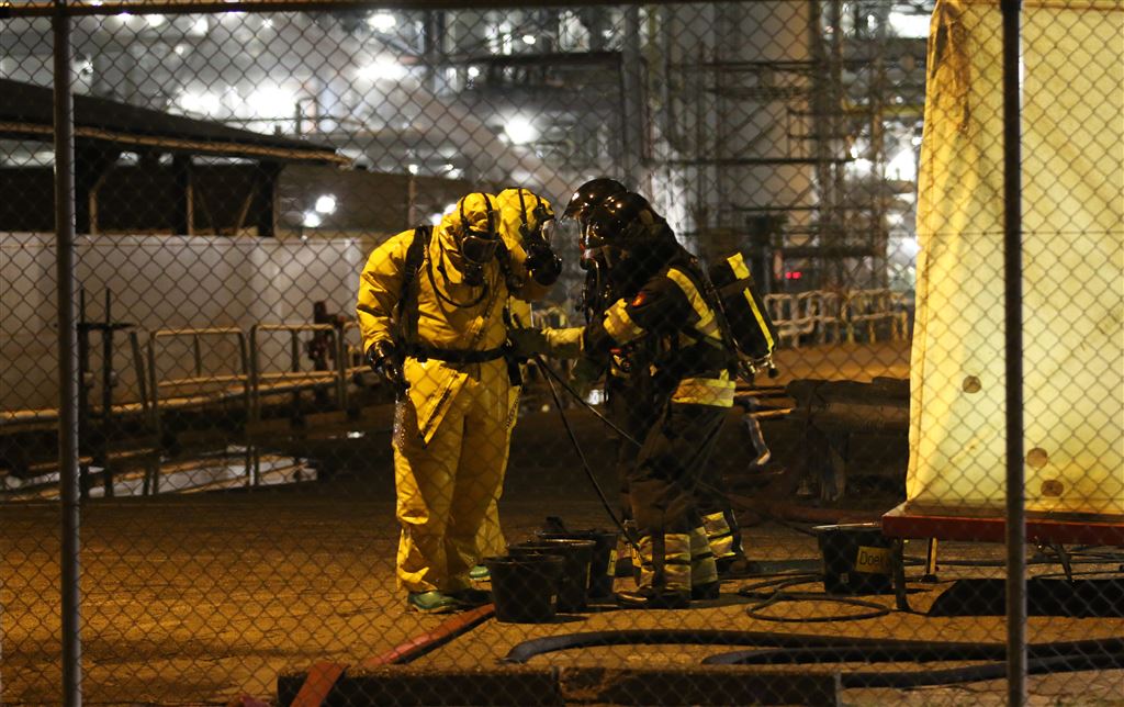 Shell door het stof vanwege brand en gifwolk Pernis