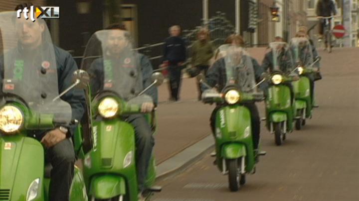 Scooters concurreren met taxi en tram Amsterdam